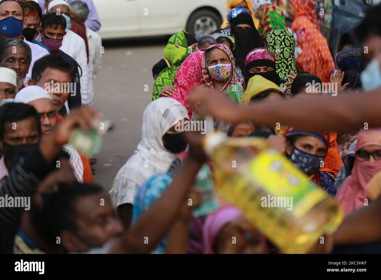 People buy subsidized food in Dhaka, Bangladesh on November 8, 2020 ...