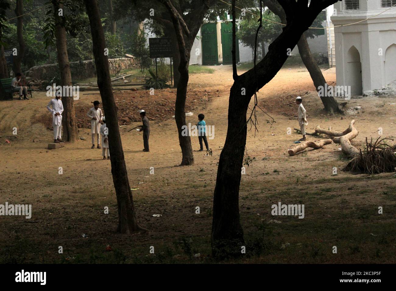 Children studying in a Madarsa near Qutub Minar are seen playing 'Gilli ...