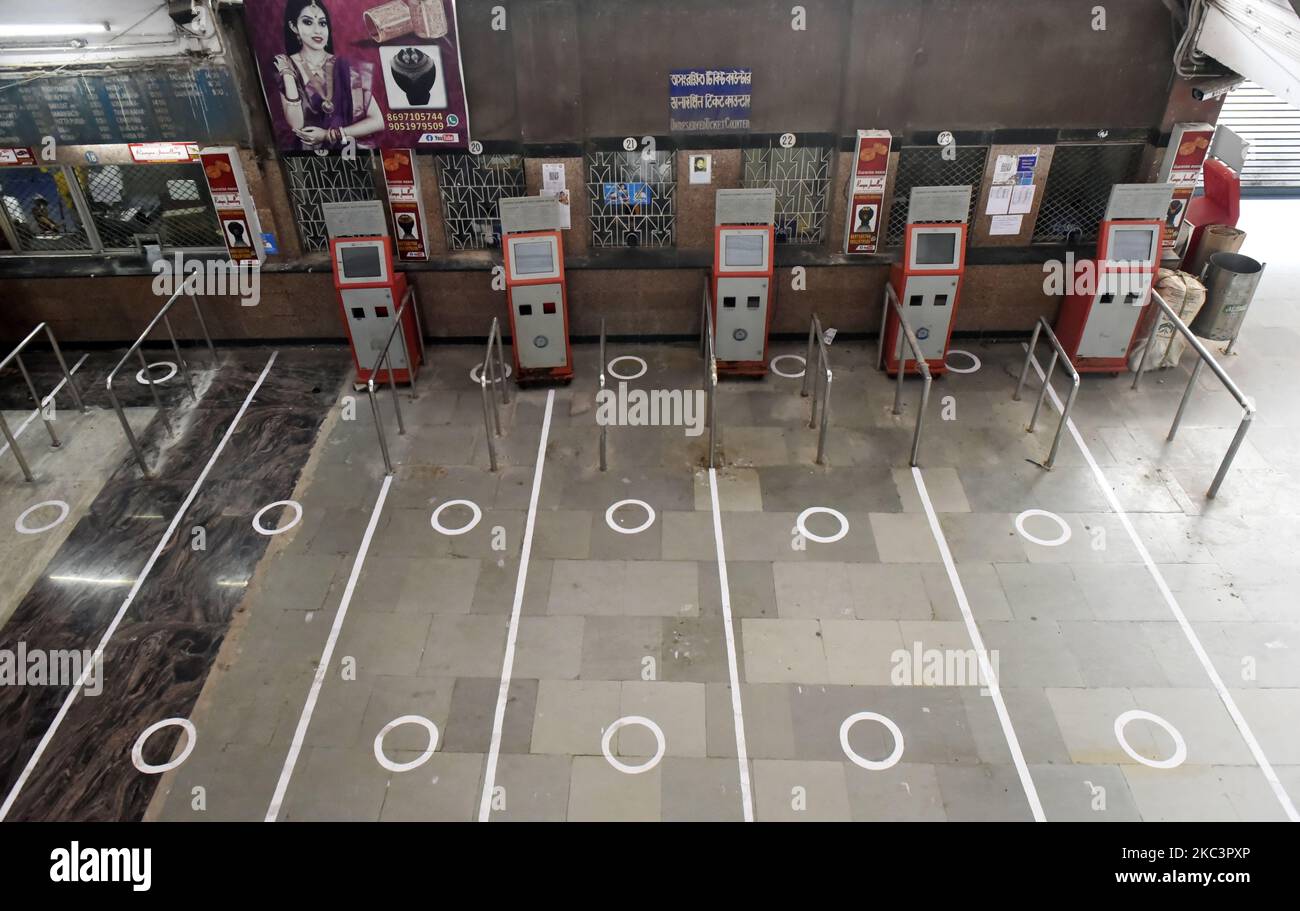 Marked circles can be seen in front of a railway ticket counter for ...