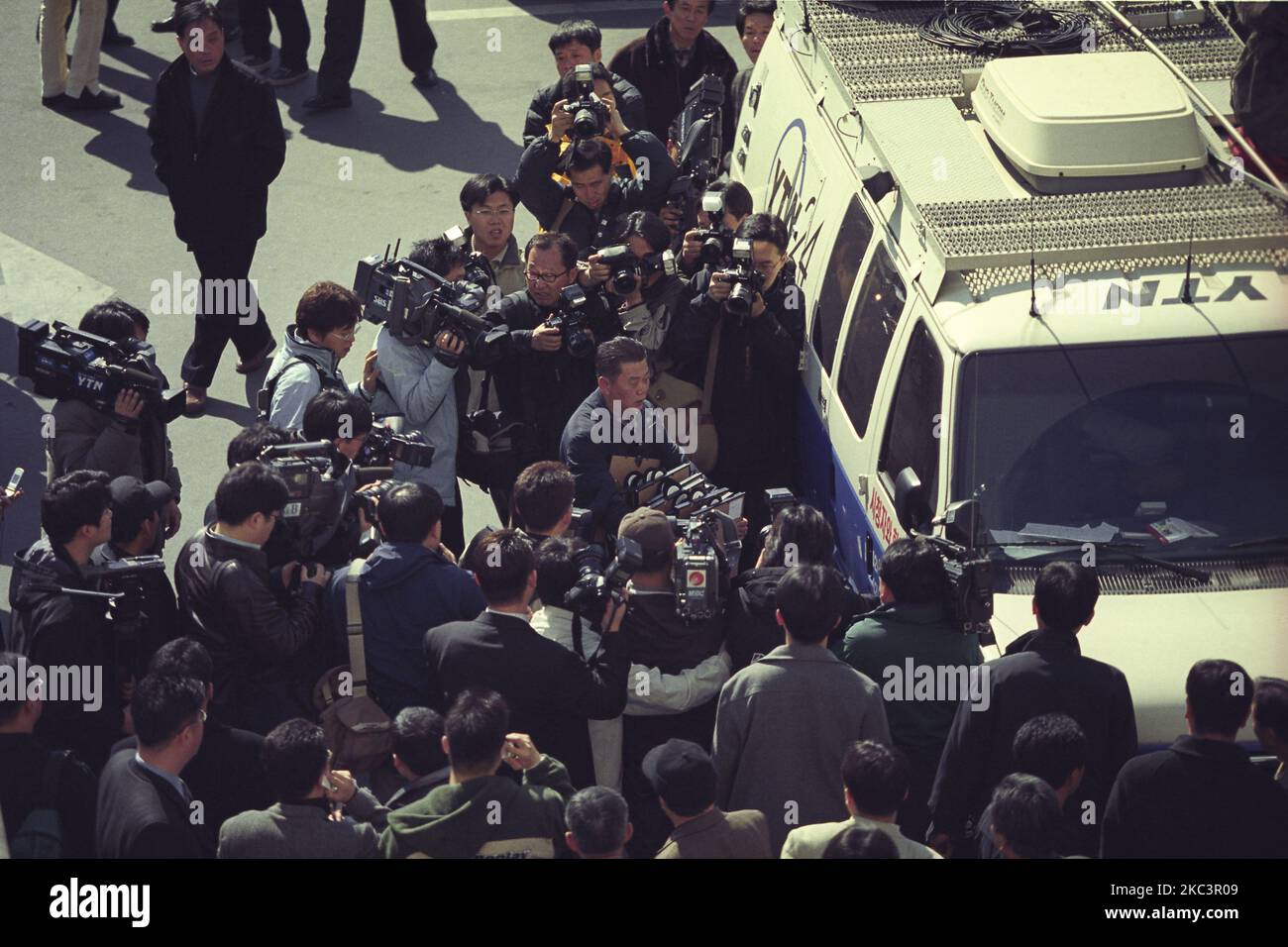 A Valunteer man hold victims portrait pictures moving to group memorial ...