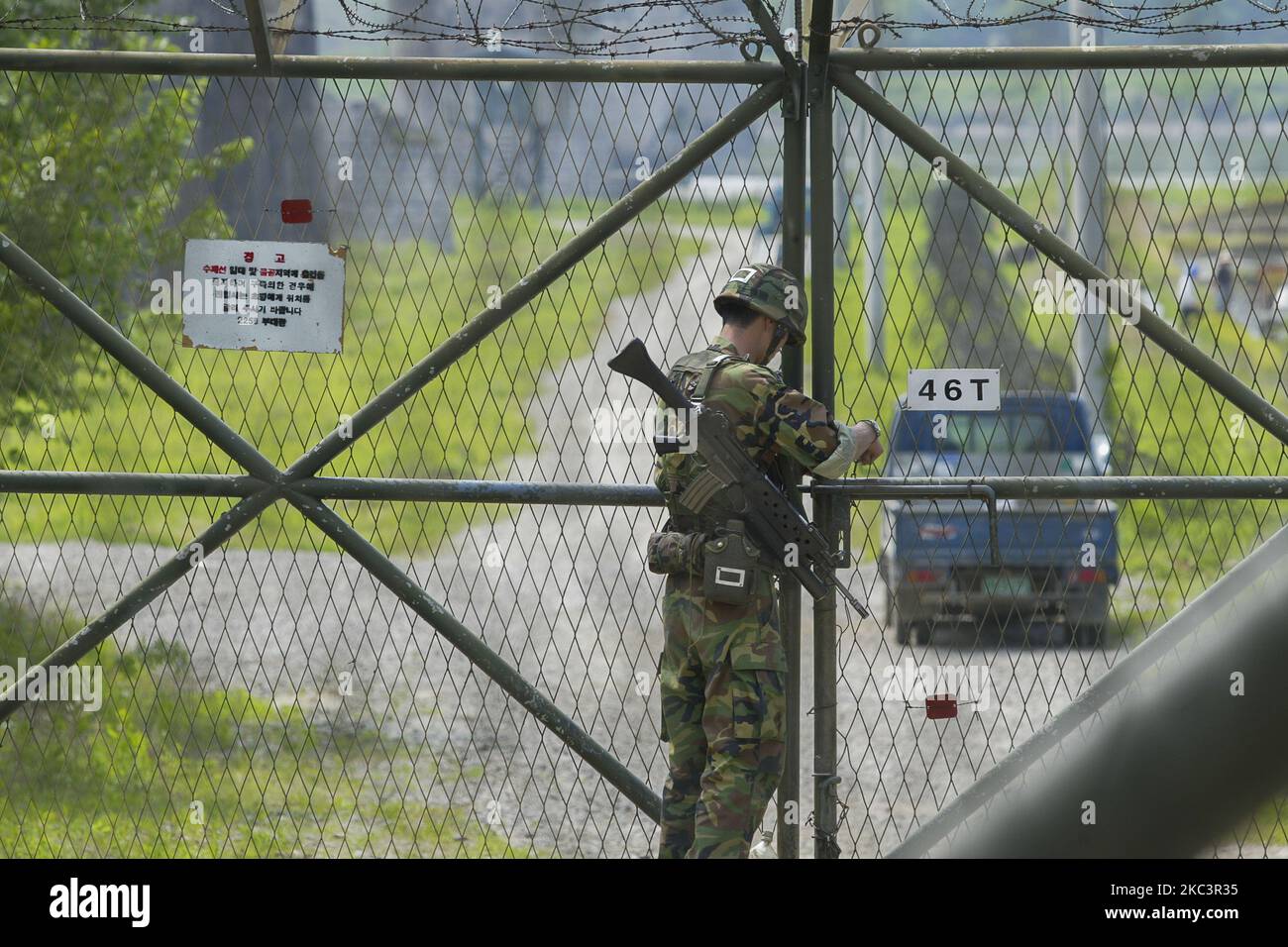 South Korean Soldier lock barbed-wire gate at DMZ in Paju, South Korea ...
