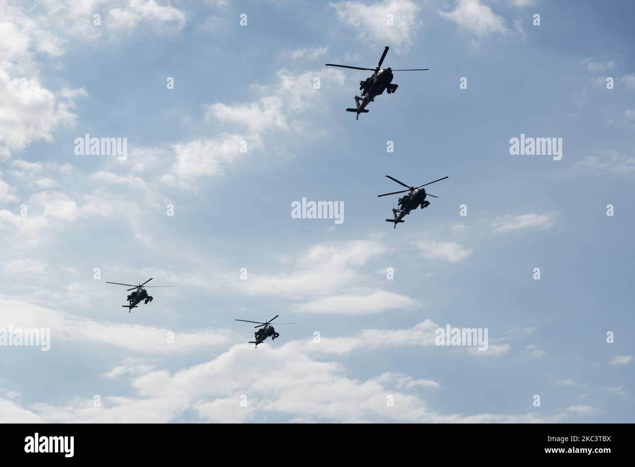 Boeing AH-64 attack helicopters on formation during air show. Greek Air ...