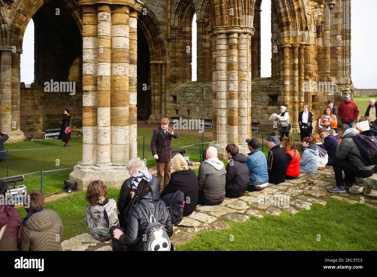 Actor telling a ghost story at Whitby Abbey during Goth Weekend Stock ...
