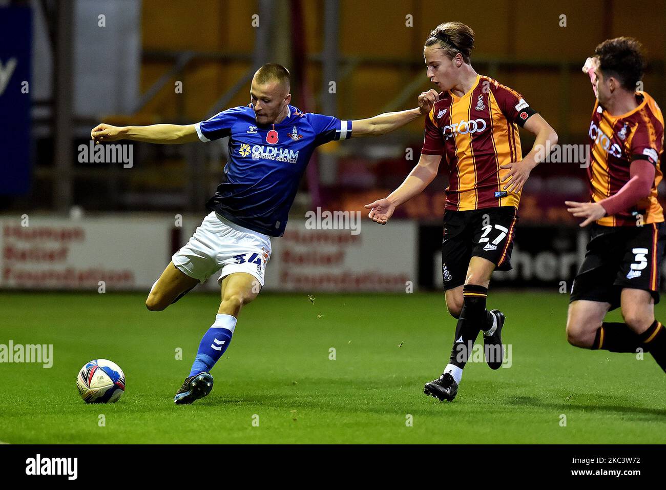 Bradford City's Connor Shanks and Oldham Athletic's Tom Hamer in action ...