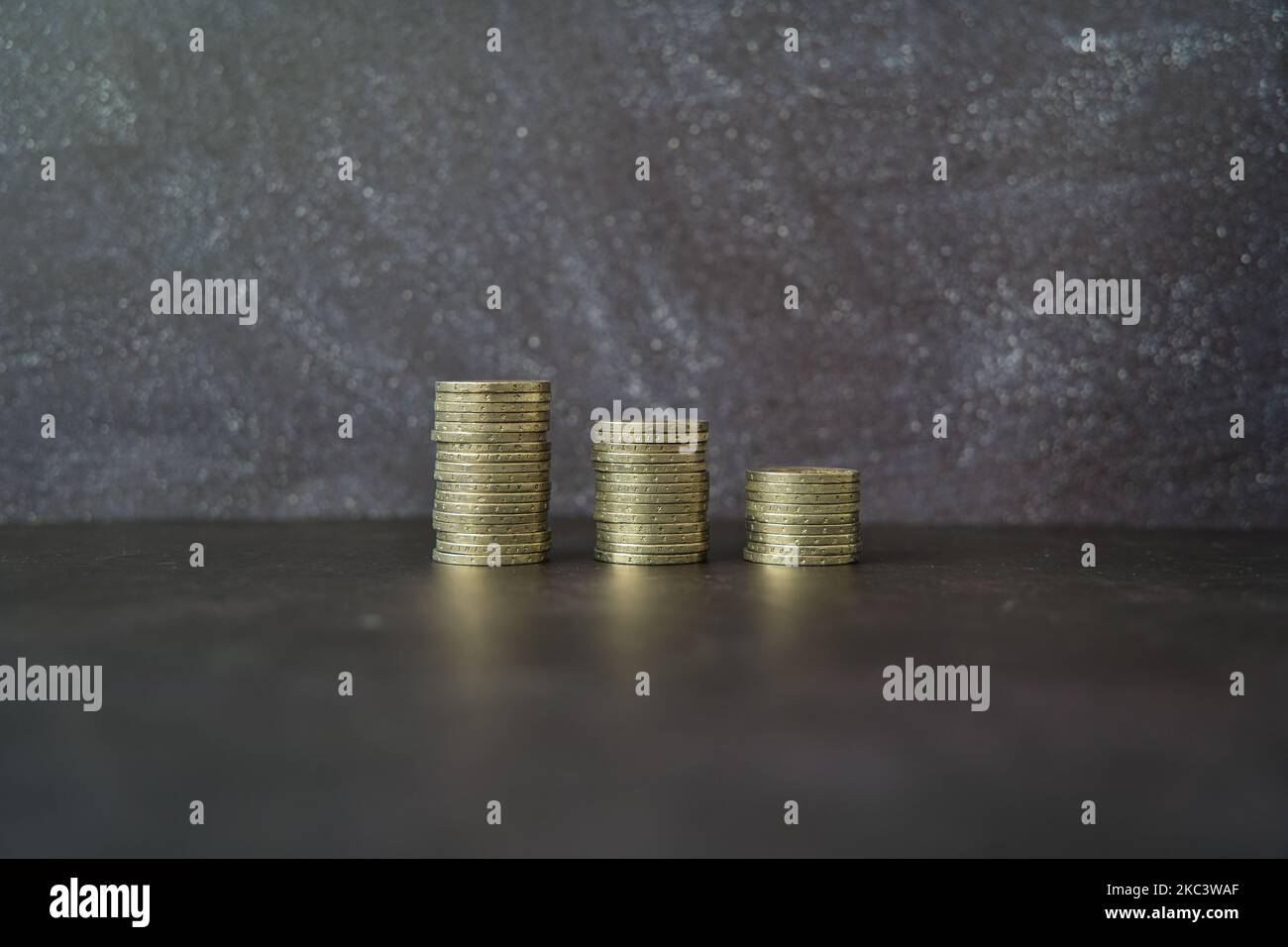The three stacks of coins decreasing in number from left to right Stock ...