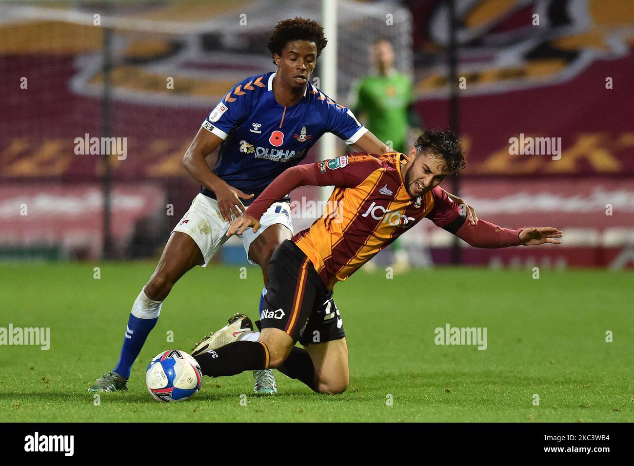 Bradford City's Levi Sutton and Oldham Athletic's Sido Jombati in ...