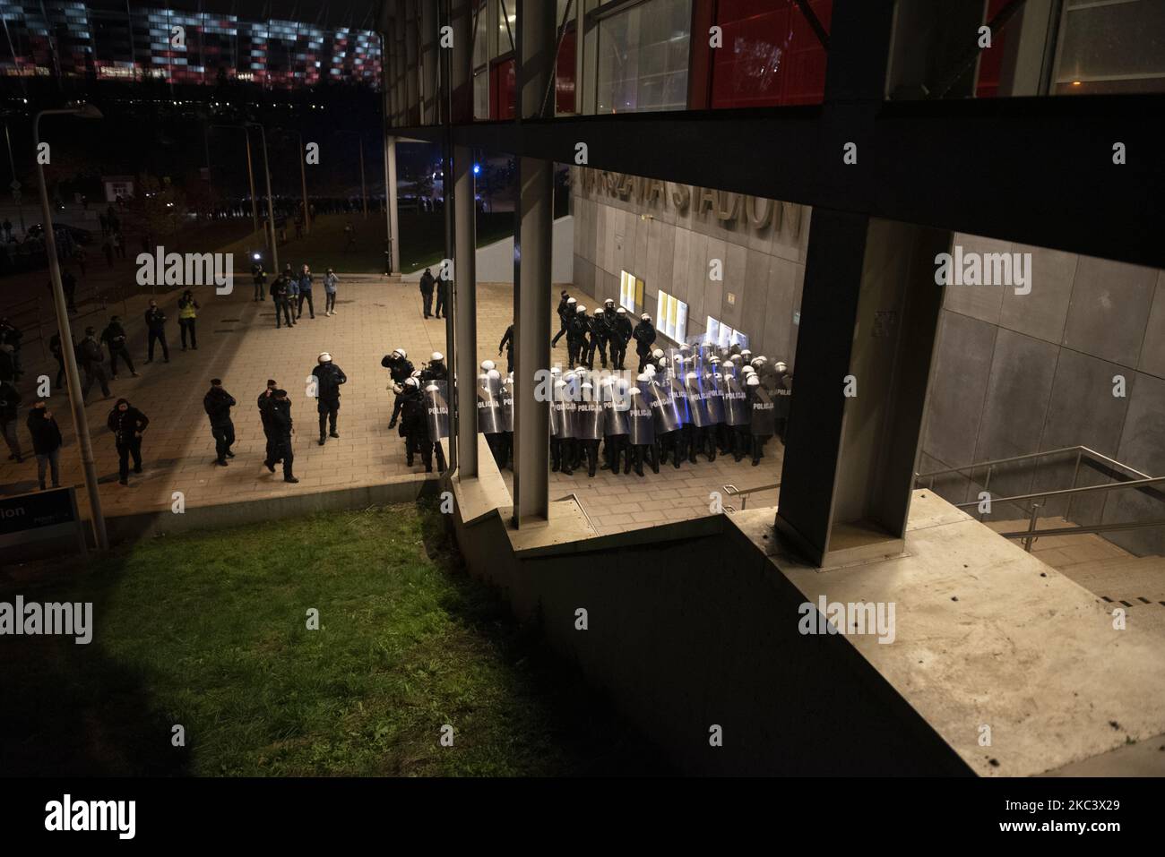 Riot police prepares to take the Warsaw Stadium train station where ...
