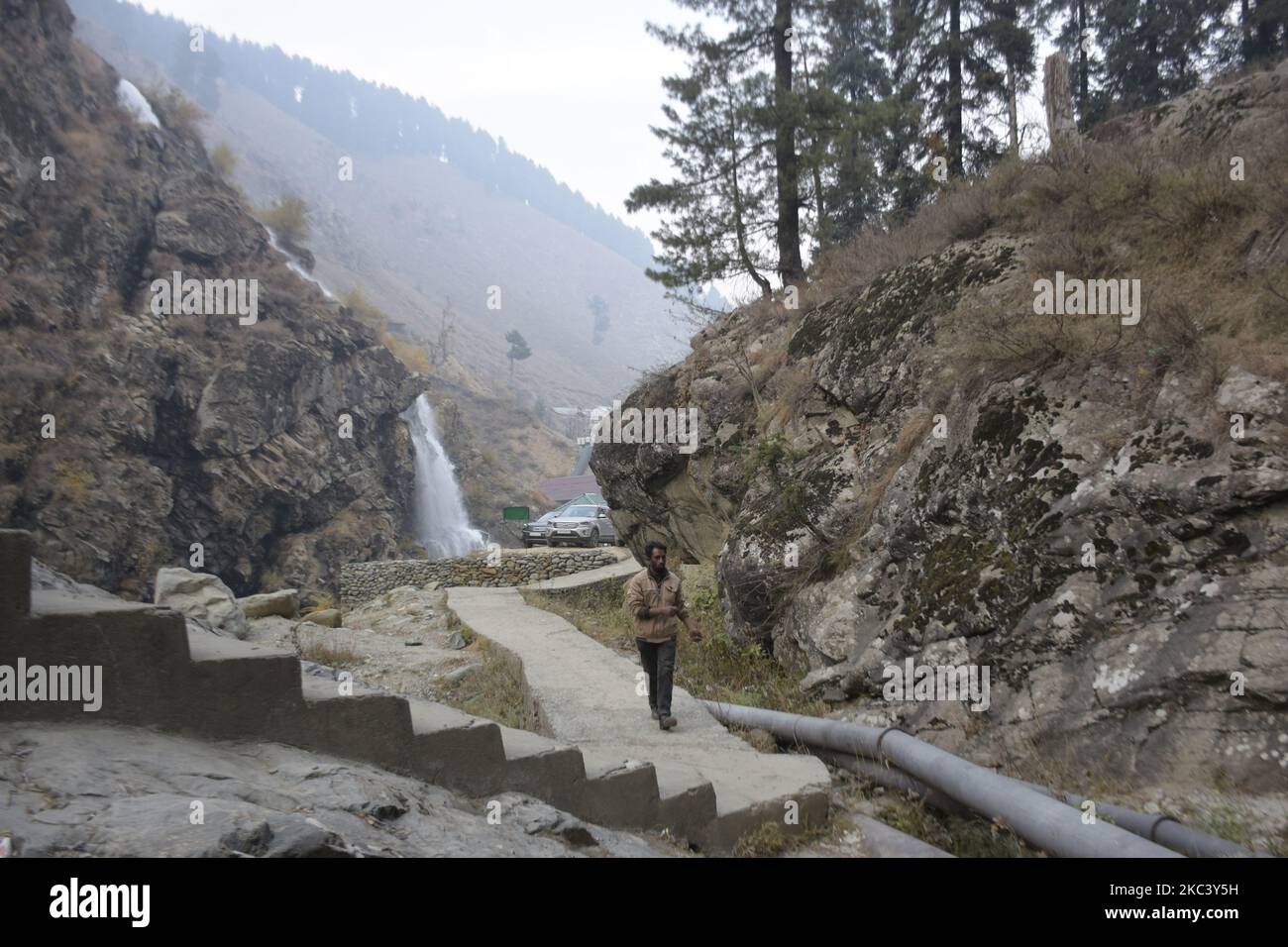 A man walks on way towards the forests in Drang area of Baramullah ...