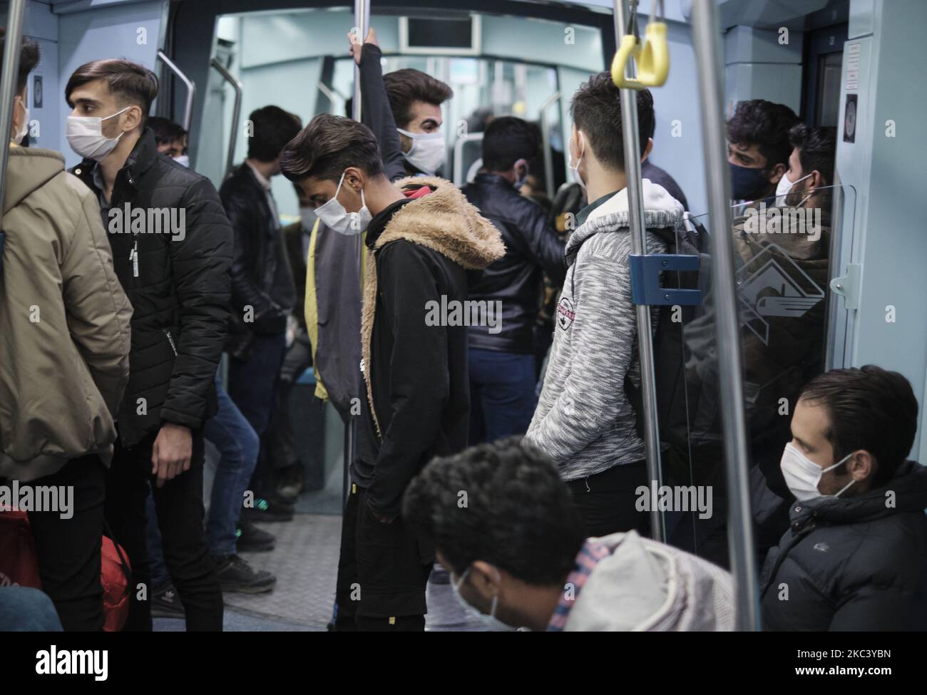 Iranian men living in Mashhad wearing protective face mask but do not ...