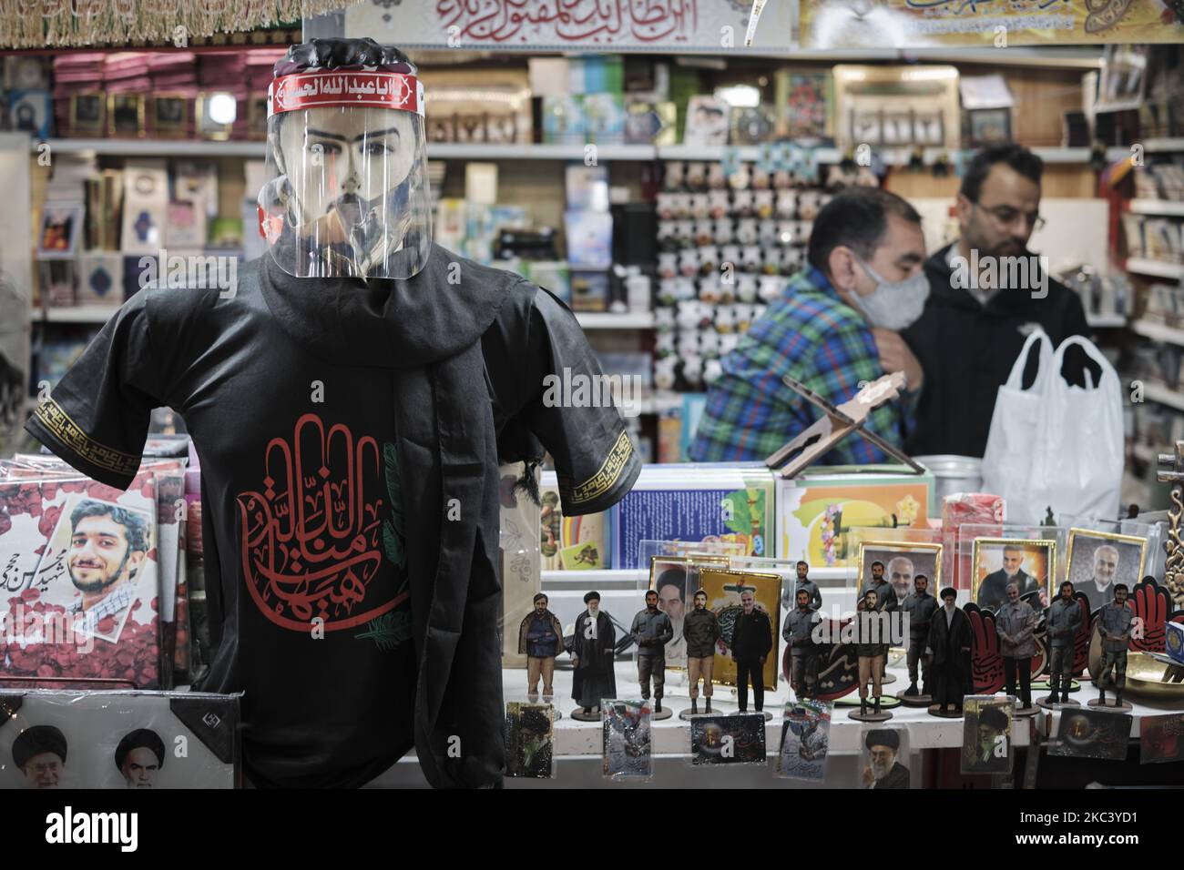 A mannequin is covered with a protective face shield and a religious ...