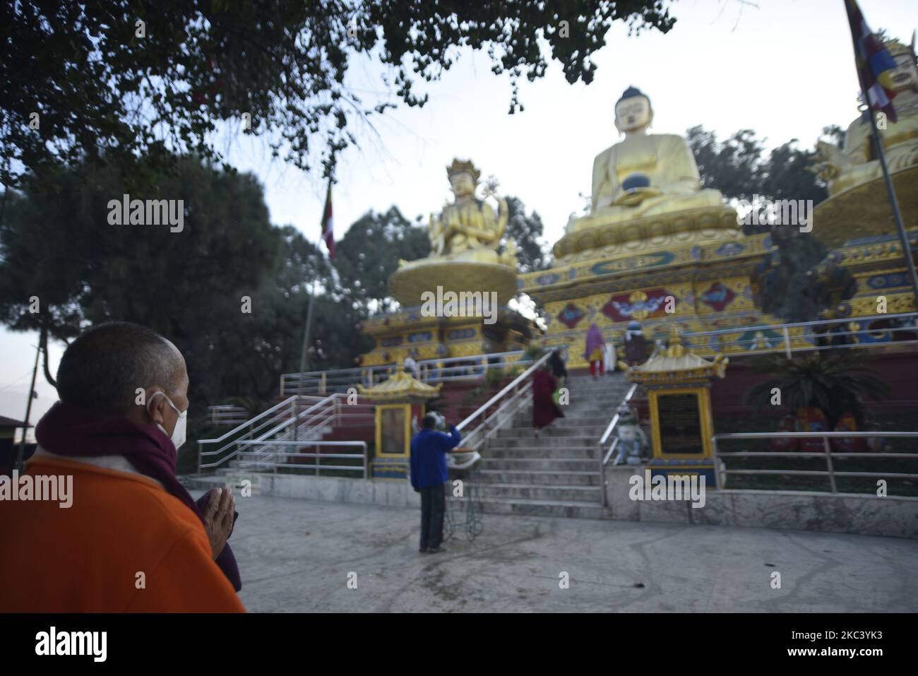 A devotee offering ritual prayer inside Buddha Park at Kathmandu, Nepal ...