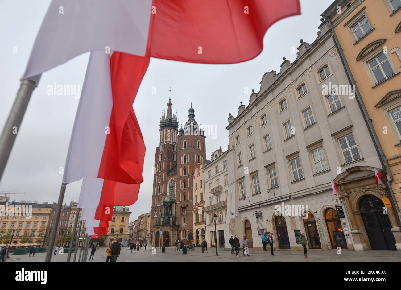 Quite empty Krakow's UNESCO Market Square decorated with white-red ...