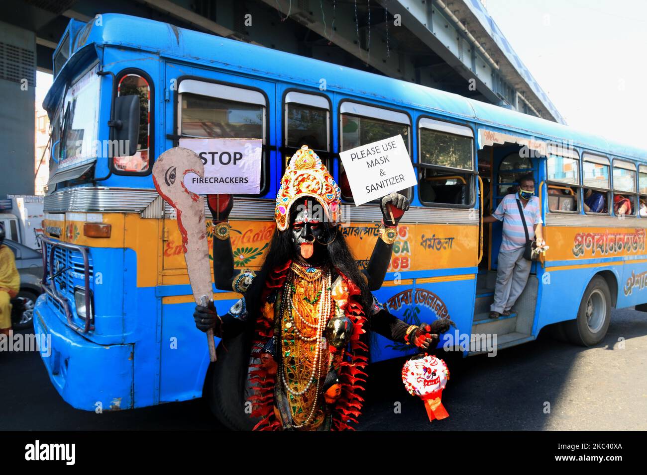 Krishna Bairagi a Bahurupi artist dressed as Hindu Goddess Kali hold the Covid-19 awareness hold ...