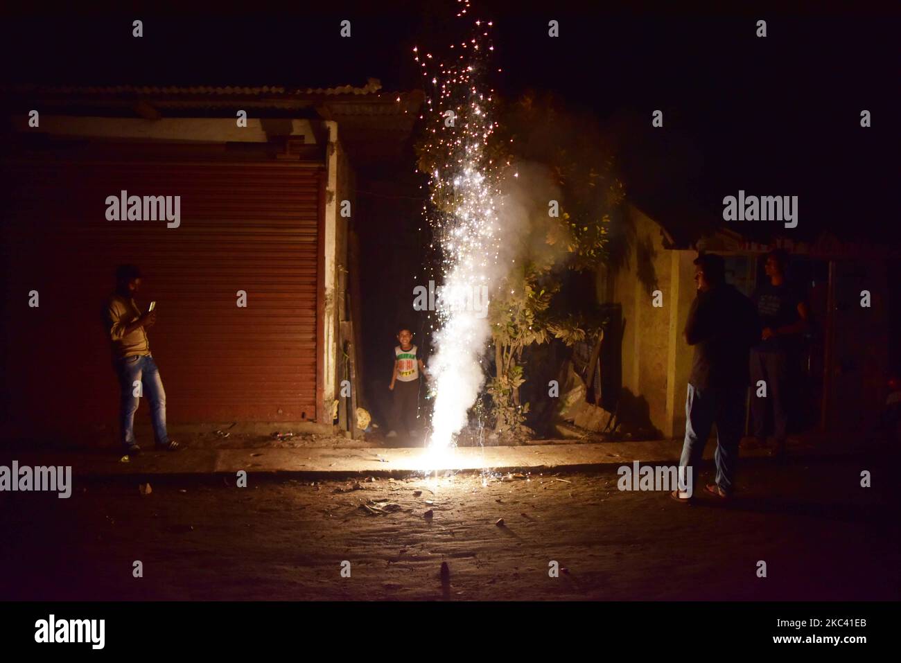 People burst firecrackers on the occasion of Diwali ,the Hindu festival ...