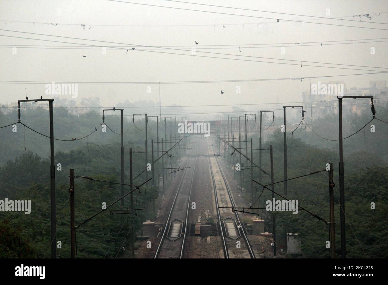Railway tracks under heavy smog conditions near Akshardham in New Delhi ...