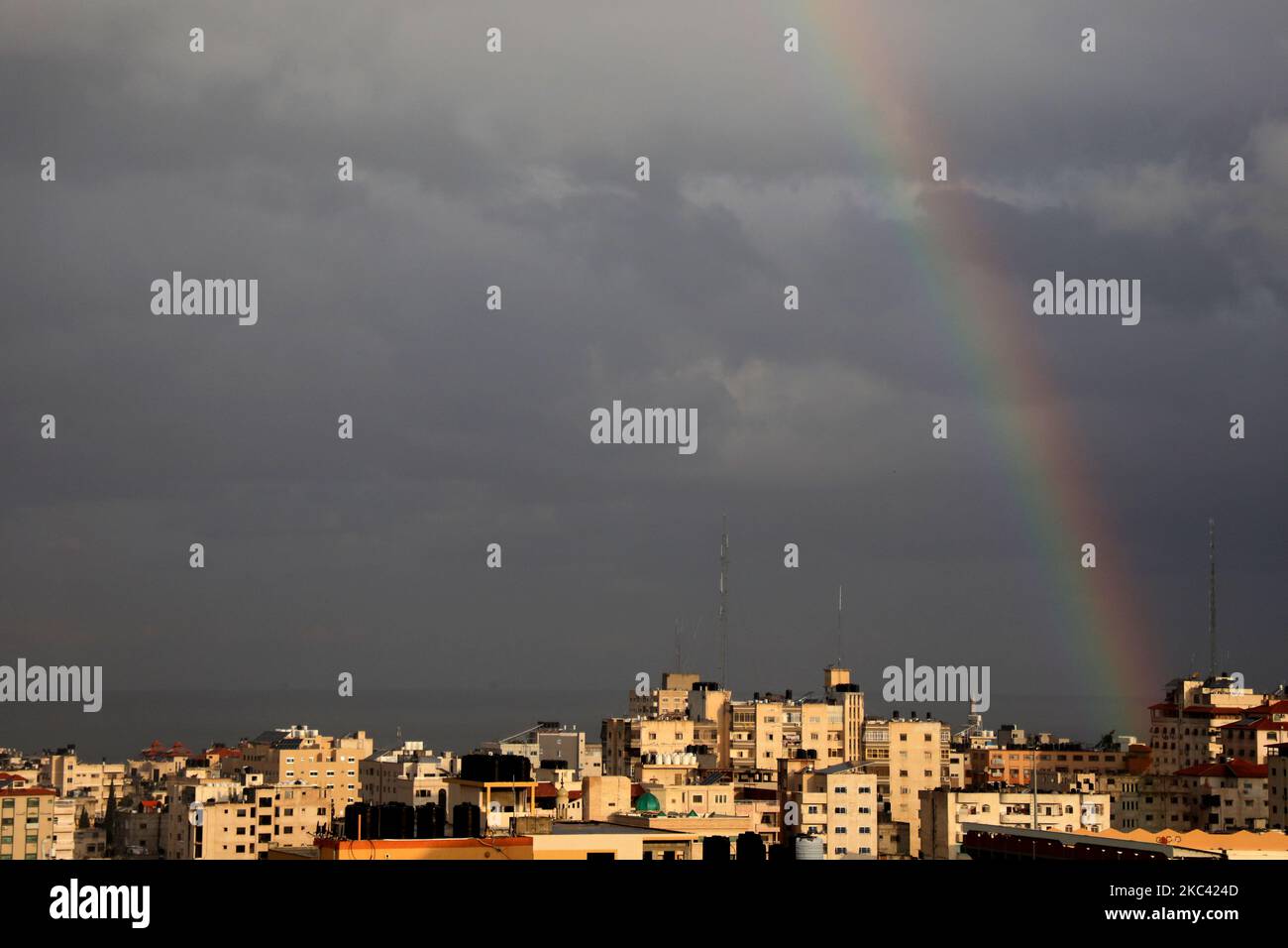 A rainbow rises over Gaza City after a rain shower on November 15, 2020 ...
