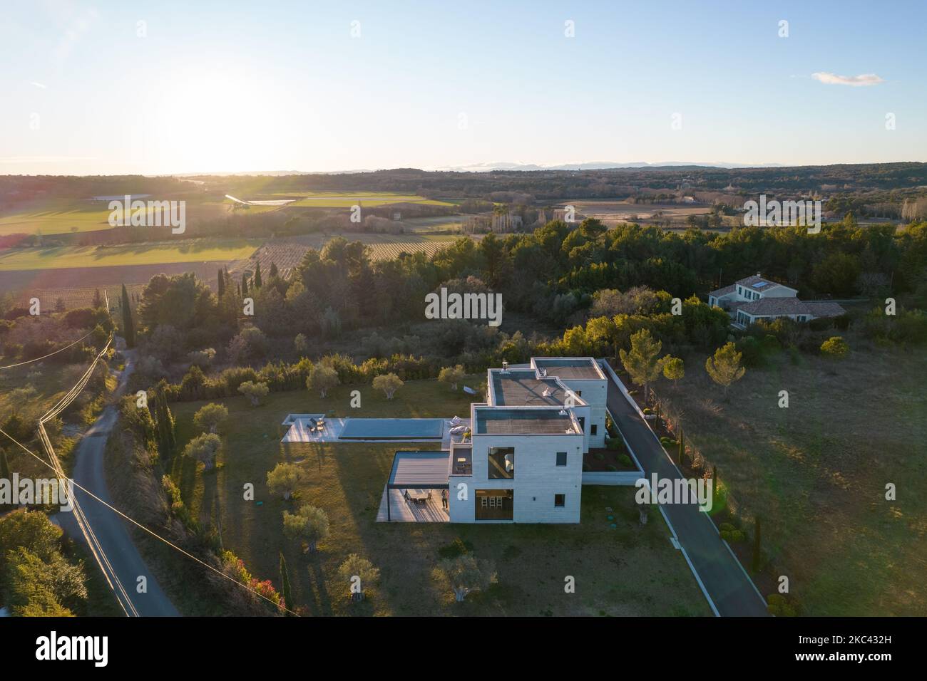 An aerial view of a large white contemporary house in geometric shapes ...