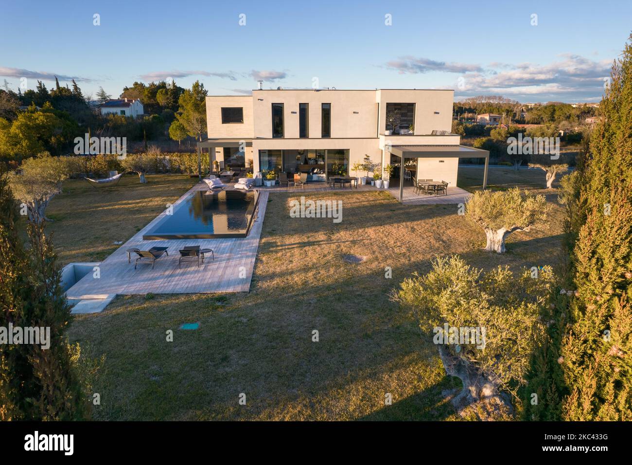 An aerial view of a large white contemporary house in geometric shapes ...
