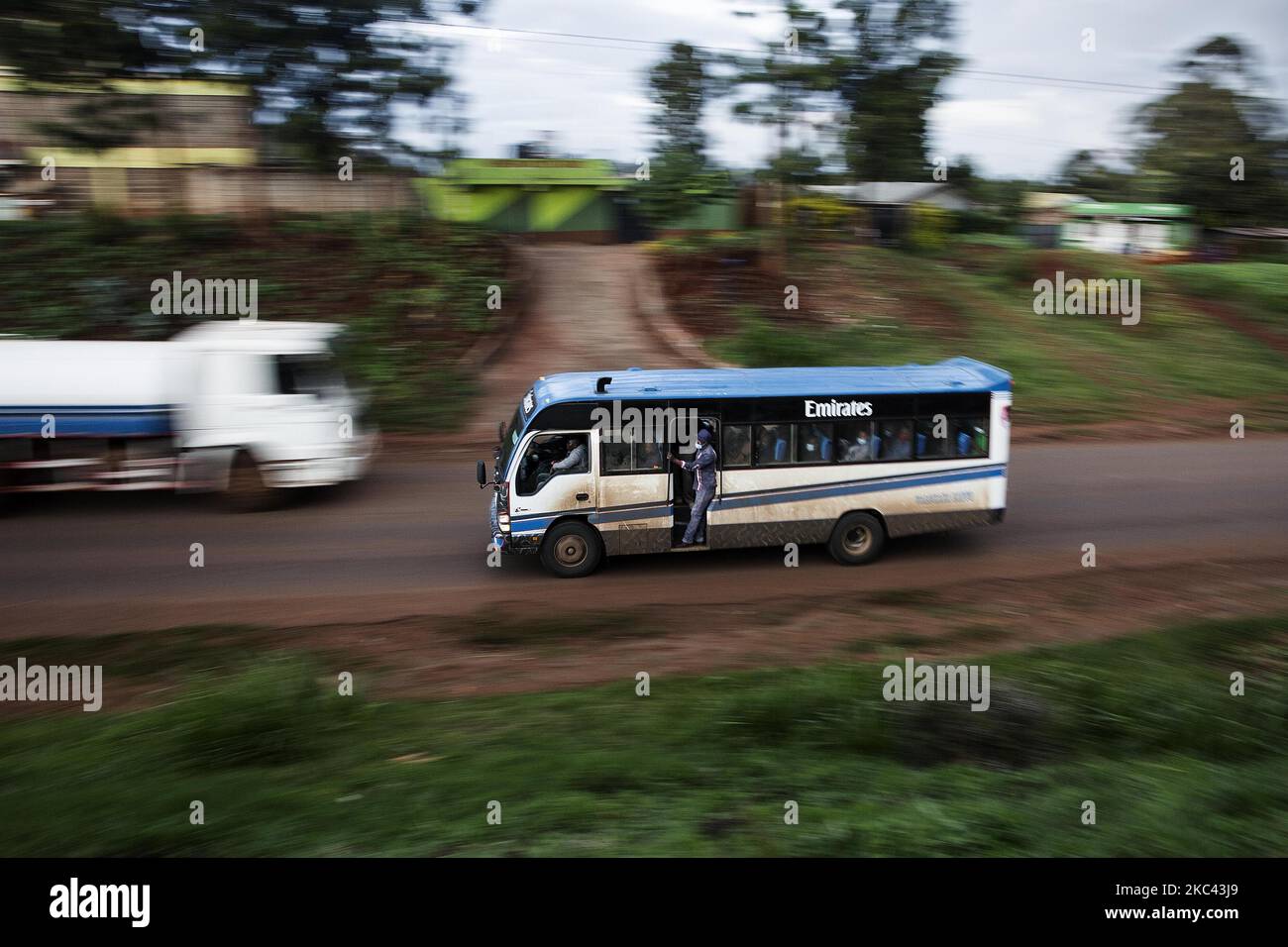 A matatu (the typical kenyan bus) travels among Lower Kabete Road ...
