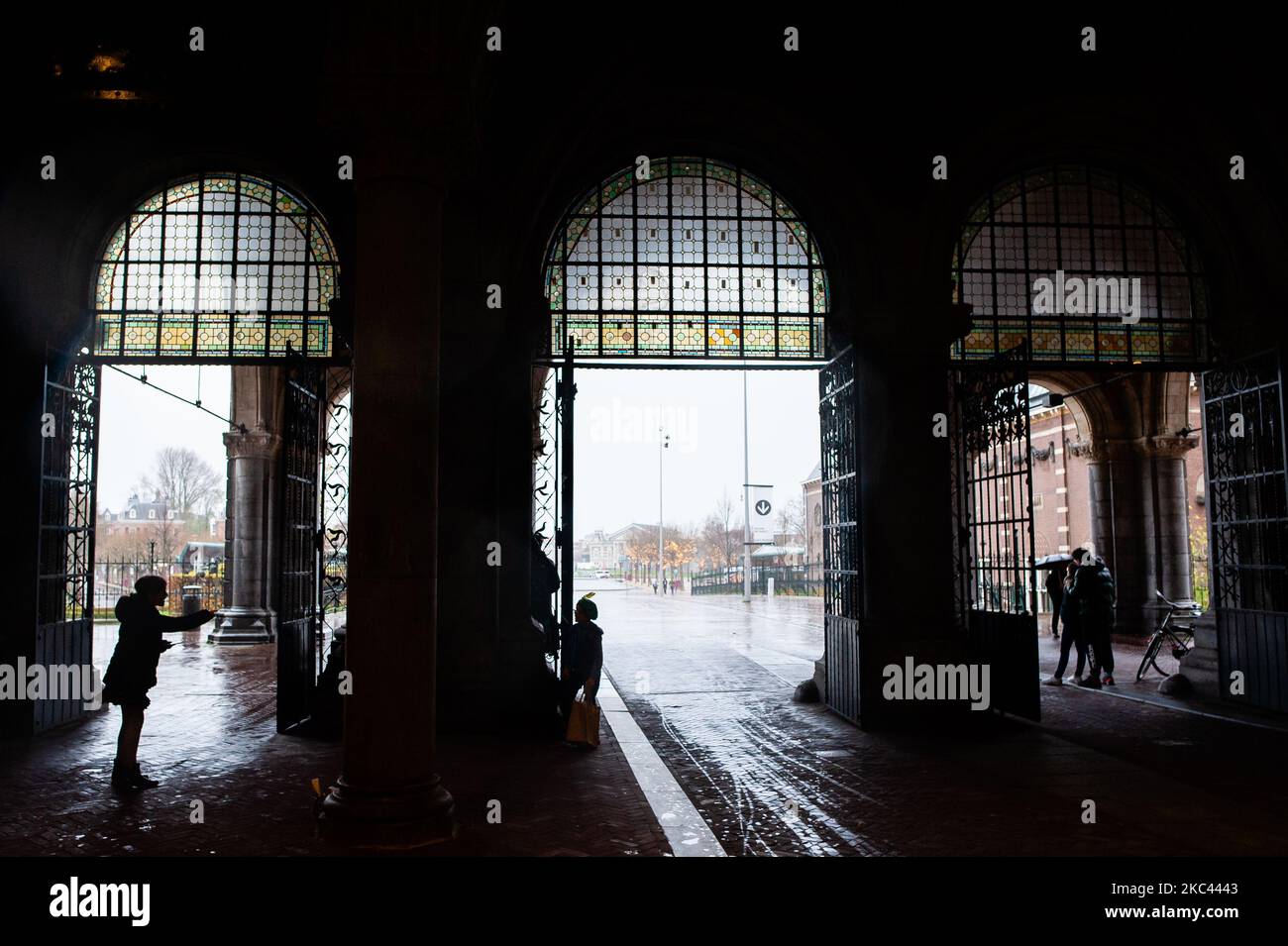 People are waiting inside the Rijksmuseum passage because of the heavy ...