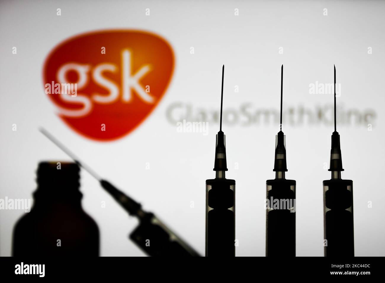 Medical syringes are seen with GlaxoSmithKline company logo displayed ...
