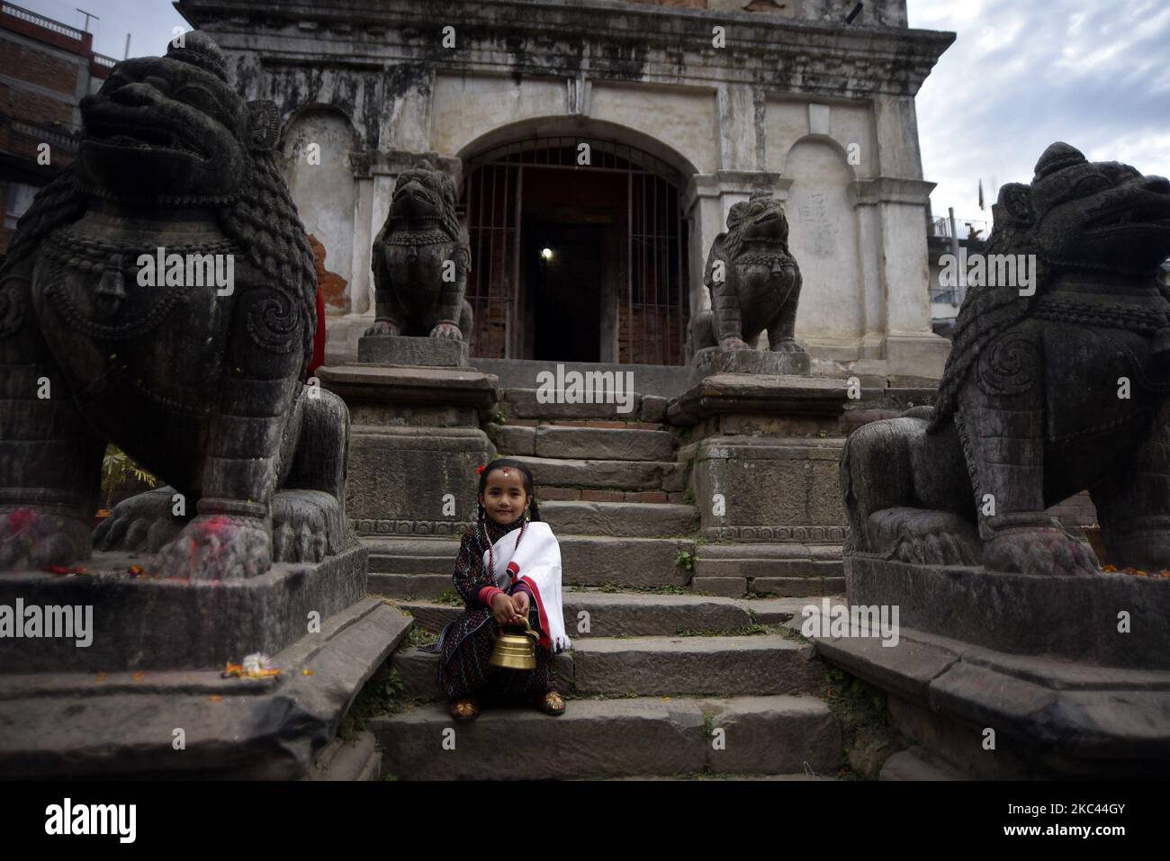 A Little Newari girl in a traditiona attire pose for photo during the ...