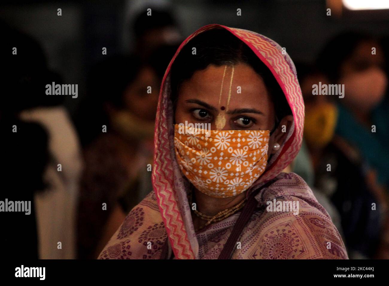 A devotee with a mask inside Iskcon temple during the 'Govardhan ...
