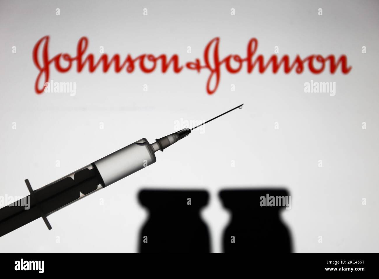 Medical syringe is seen with Johnson and Johnson company logo displayed ...