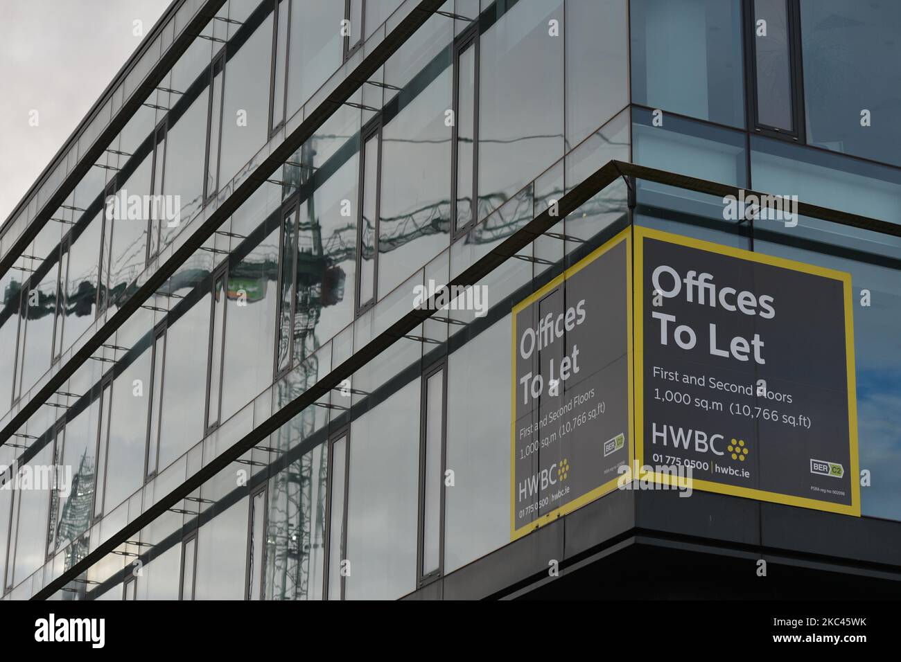 A sign 'Offices To Let' near to an ongoing construction site in Grand ...
