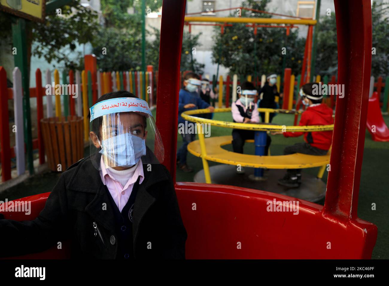Palestinians school children, clad in masks and face-shields due to the ...