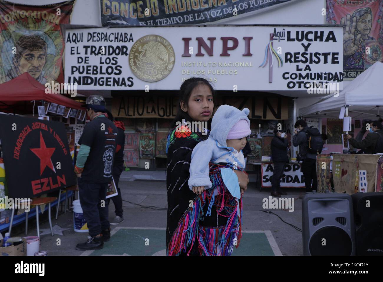 A woman and her baby in the Otomí occupation at the National Institute ...