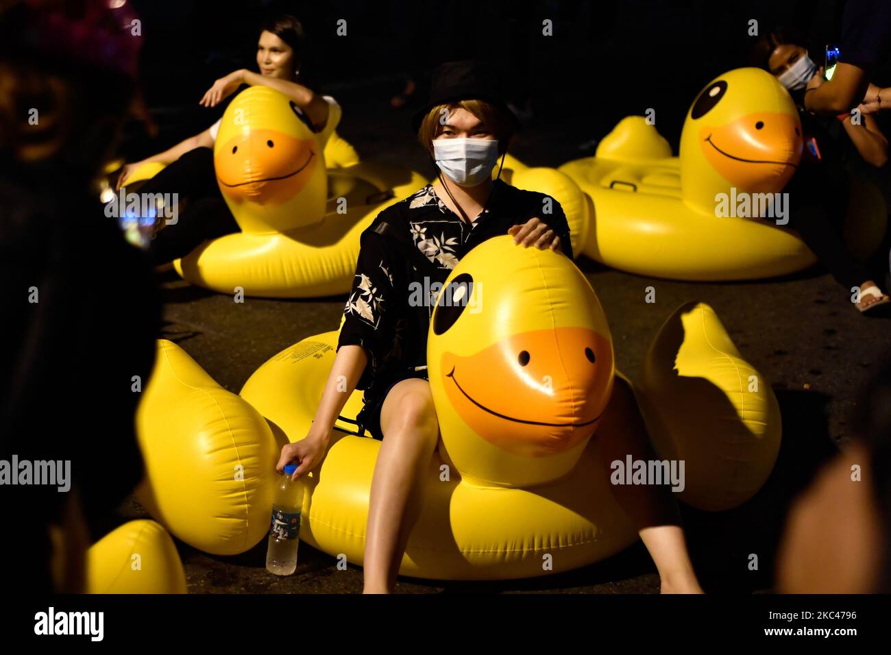 Pro-democracy protesters take a photo with an inflatable rubber duck on ...