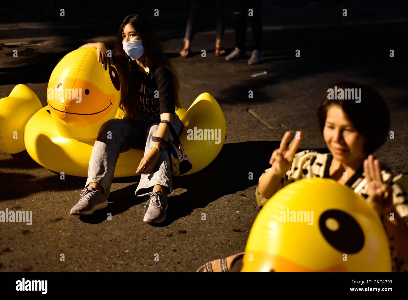Pro-democracy protesters take a photo with an inflatable rubber duck on ...