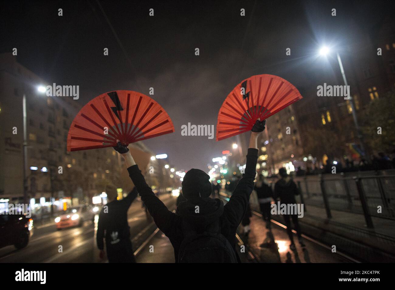 Woman holds hand fun with Womans Strike symbol during blockade of ...