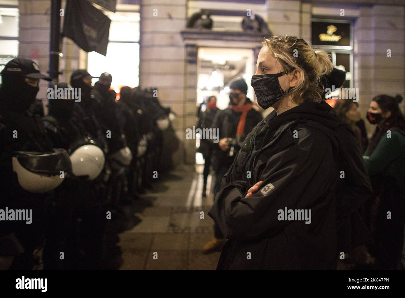 Woman stands in the front of the riots squad during blockade of ...