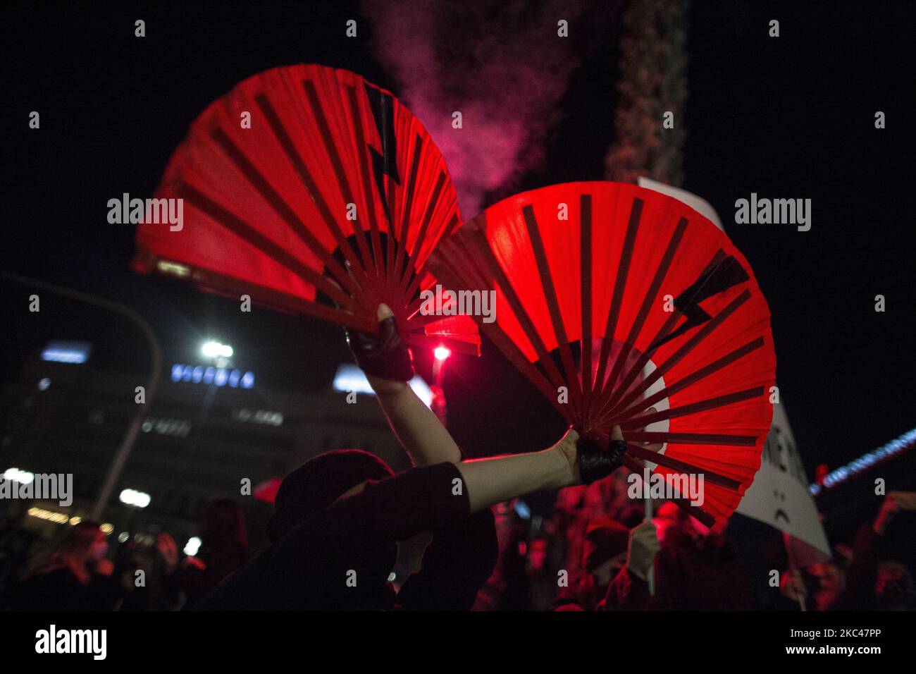 Woman holds hand fun with Womans Strike symbol during blockade of ...