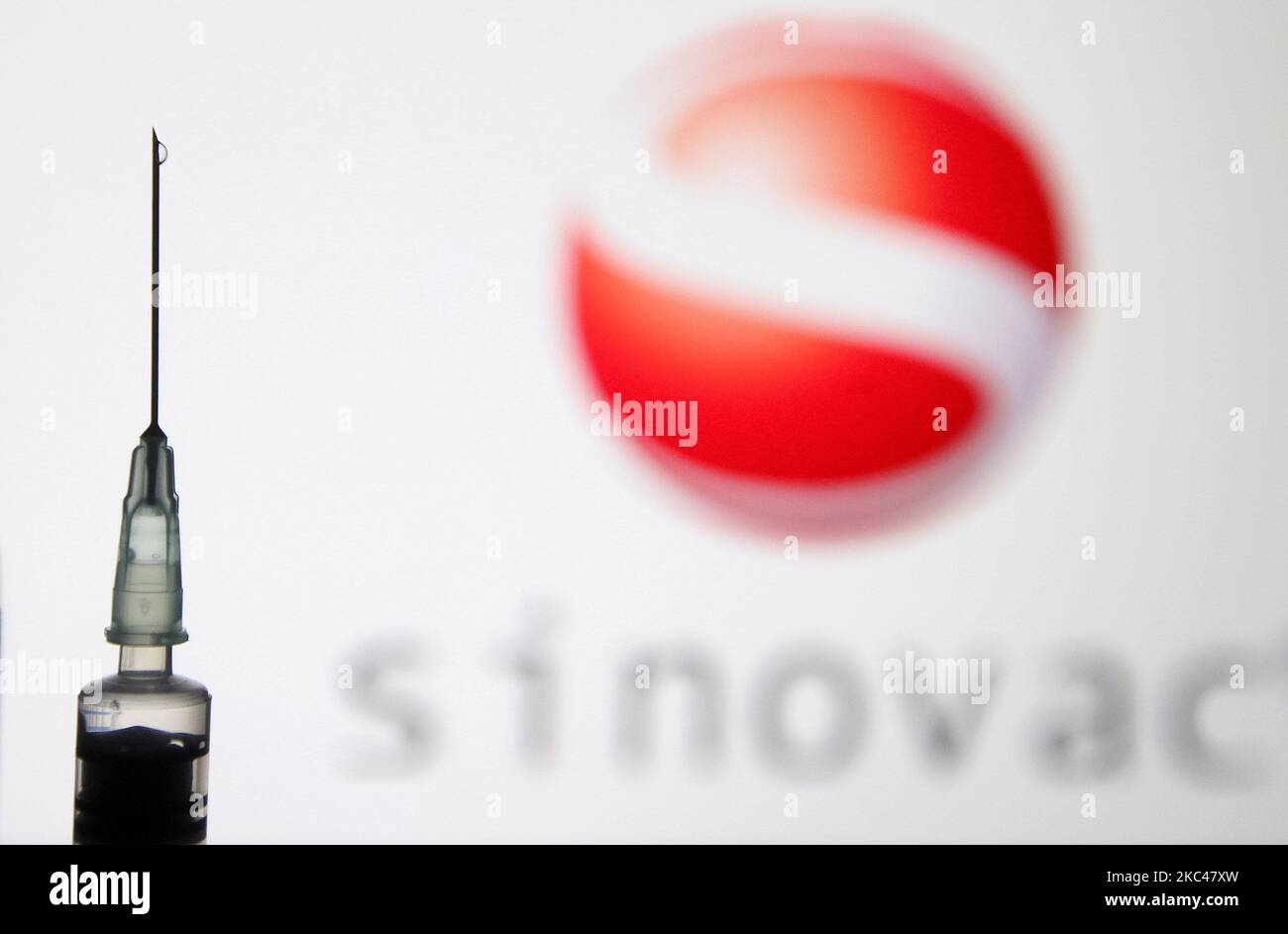 A medical syringe in front of the Chinese biopharmaceutical company ...