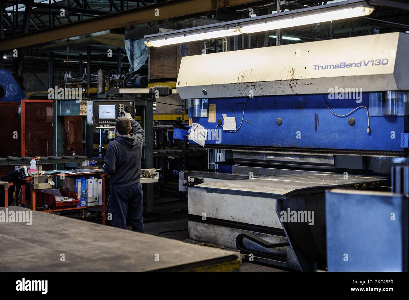 A worker of the Italian company Desmon assembling a part of a ...