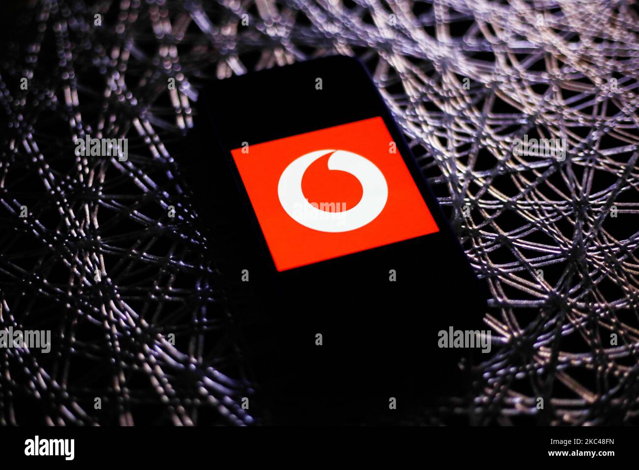 Vodafone logo is seen displayed on a phone screen in this illustration ...