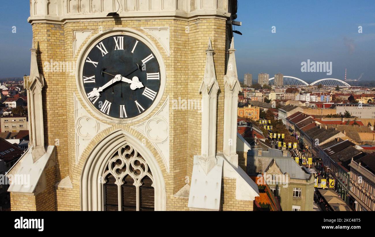 An aerial view of an old architectural building with a clock on a tower ...