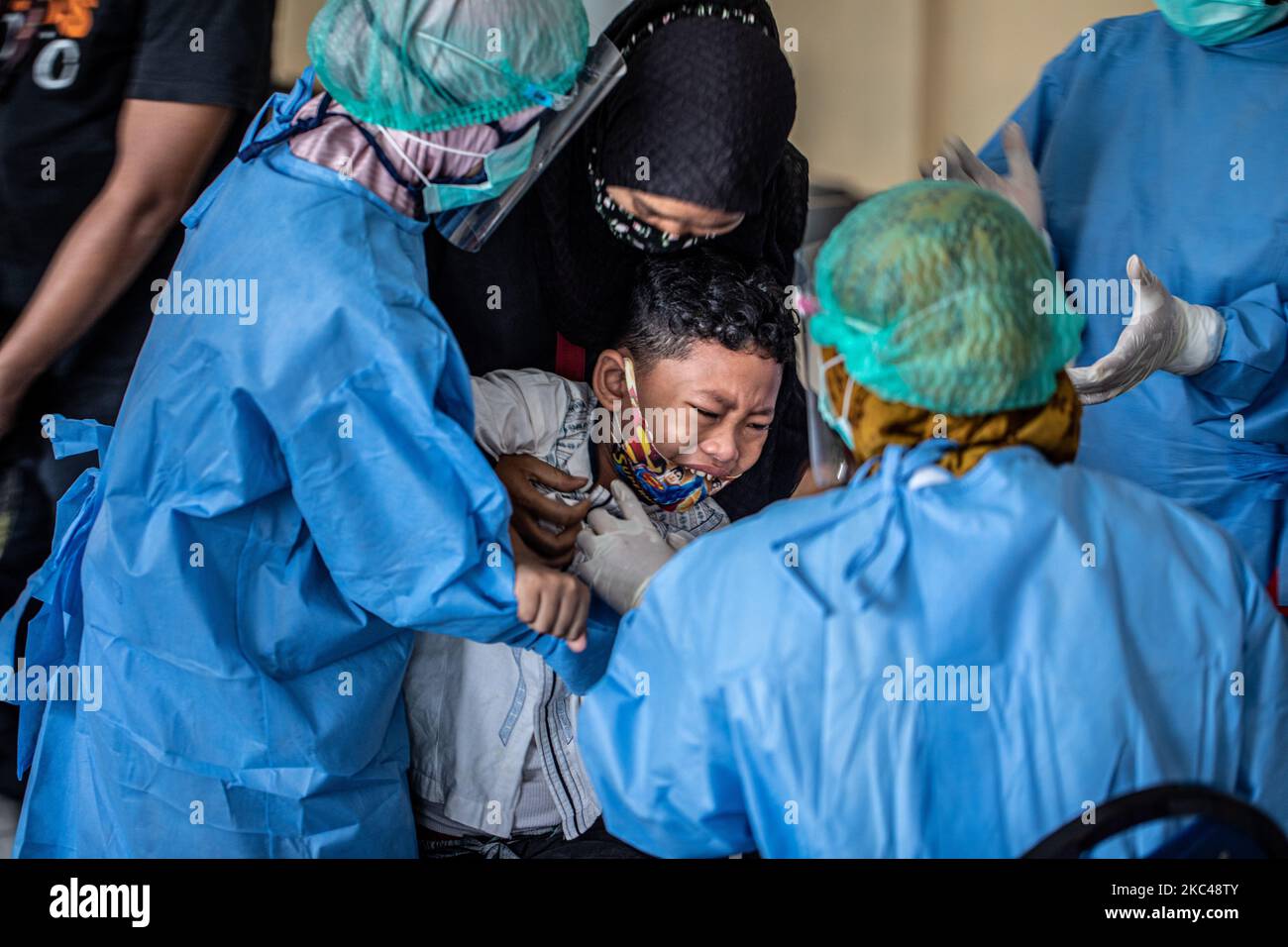 A chidl struggle to reject receiving the injection. Public Health ...