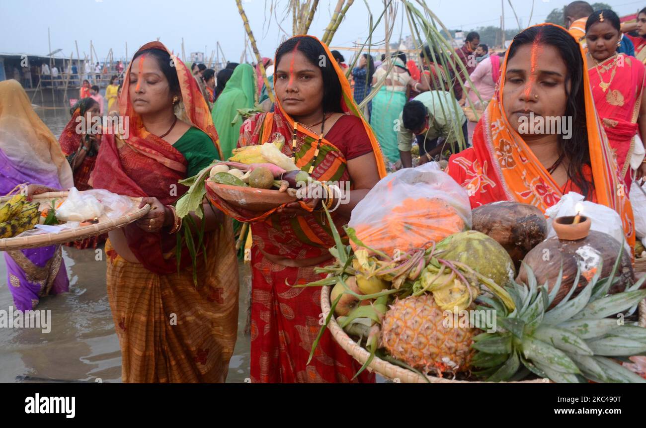 Hindu devotees offer prayers during the Chhath Puja Festival on the ...