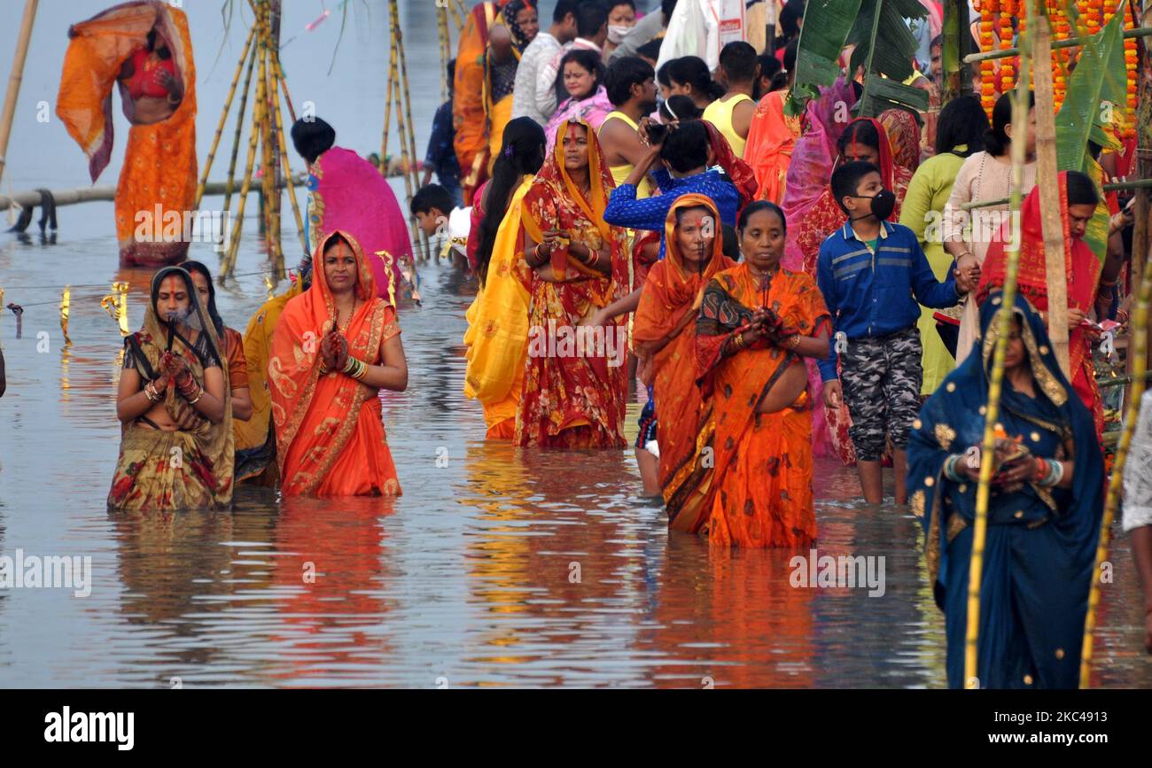 Hindu devotees offer prayers during the Chhath Puja Festival on the ...