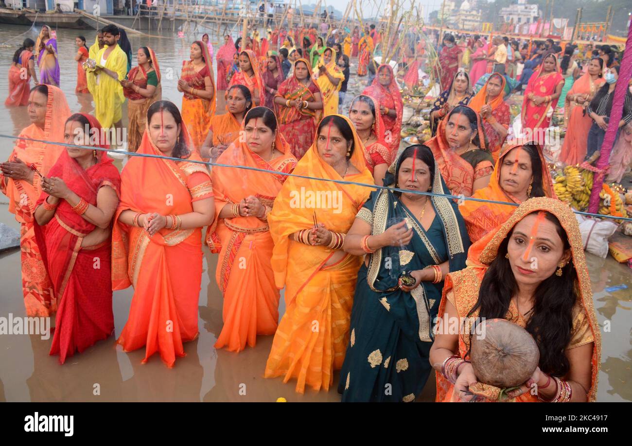 Hindu devotees offer prayers during the Chhath Puja Festival on the ...