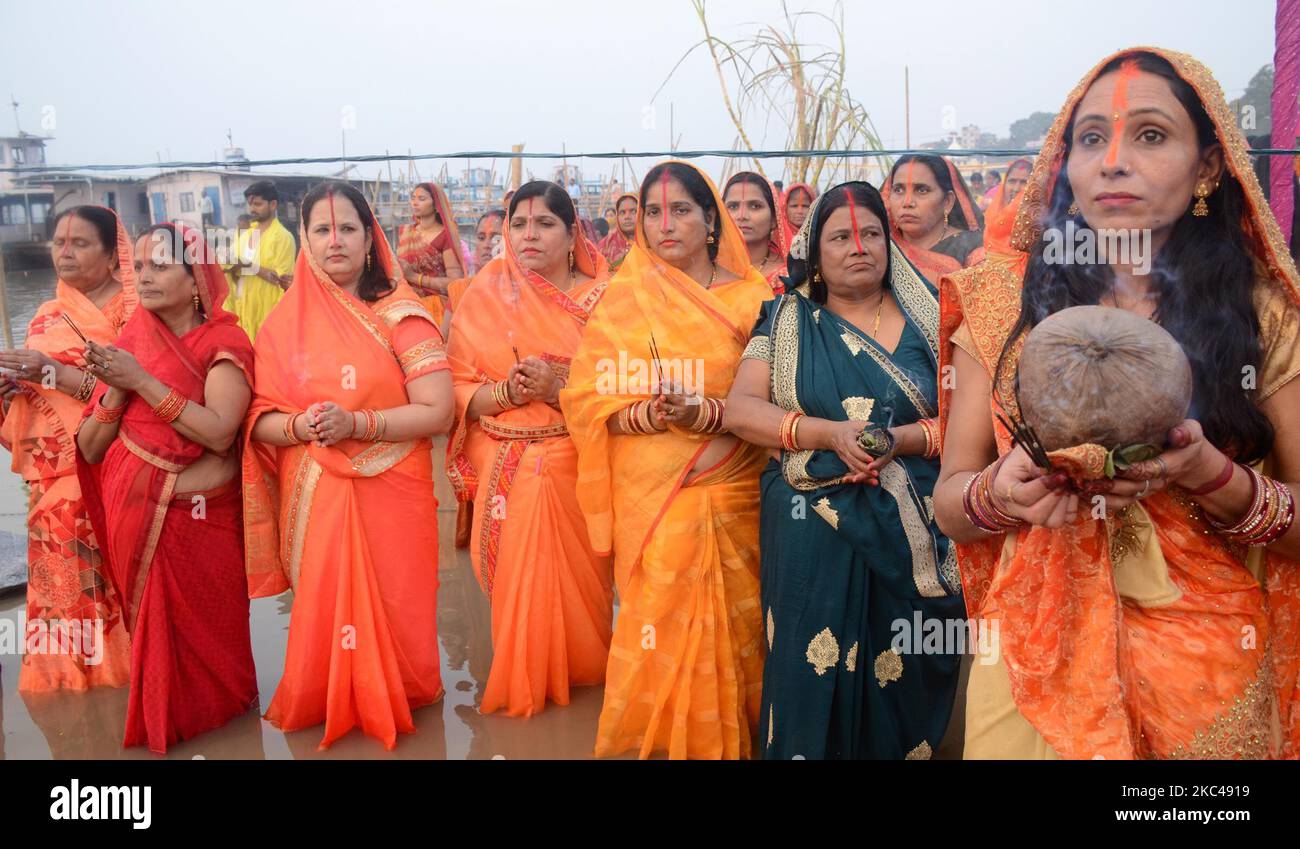Hindu devotees offer prayers during the Chhath Puja Festival on the ...