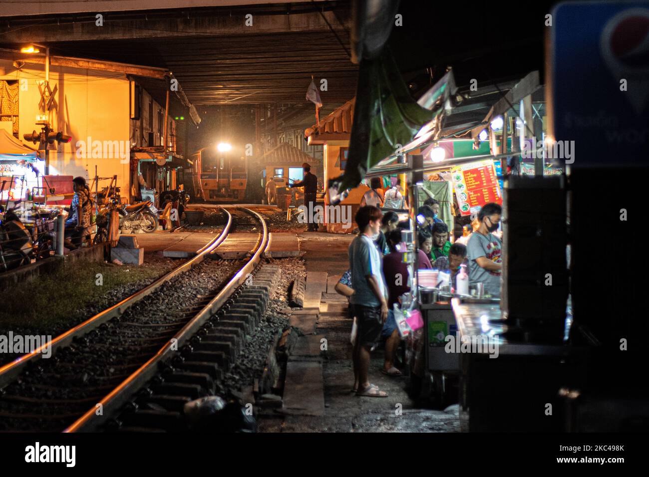A train is seen arriving at Talat Phlu station in Talat Phlu district ...