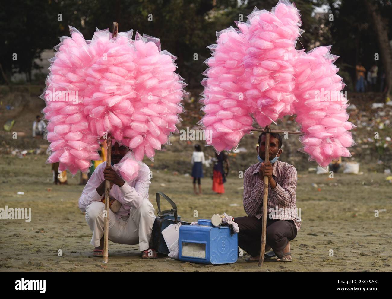Vendors selling sugar candy on the banks of Brahmaputra river on the ...