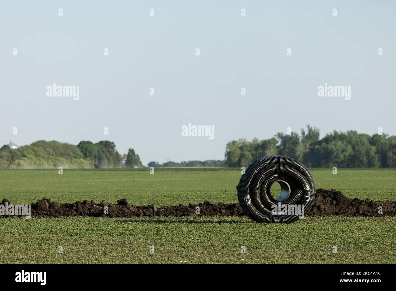Agricultural drainage tubing in the field Stock Photo - Alamy