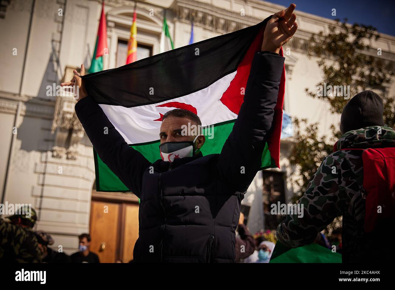 A man carrying a Saharan flag during a demonstration to demand the end ...