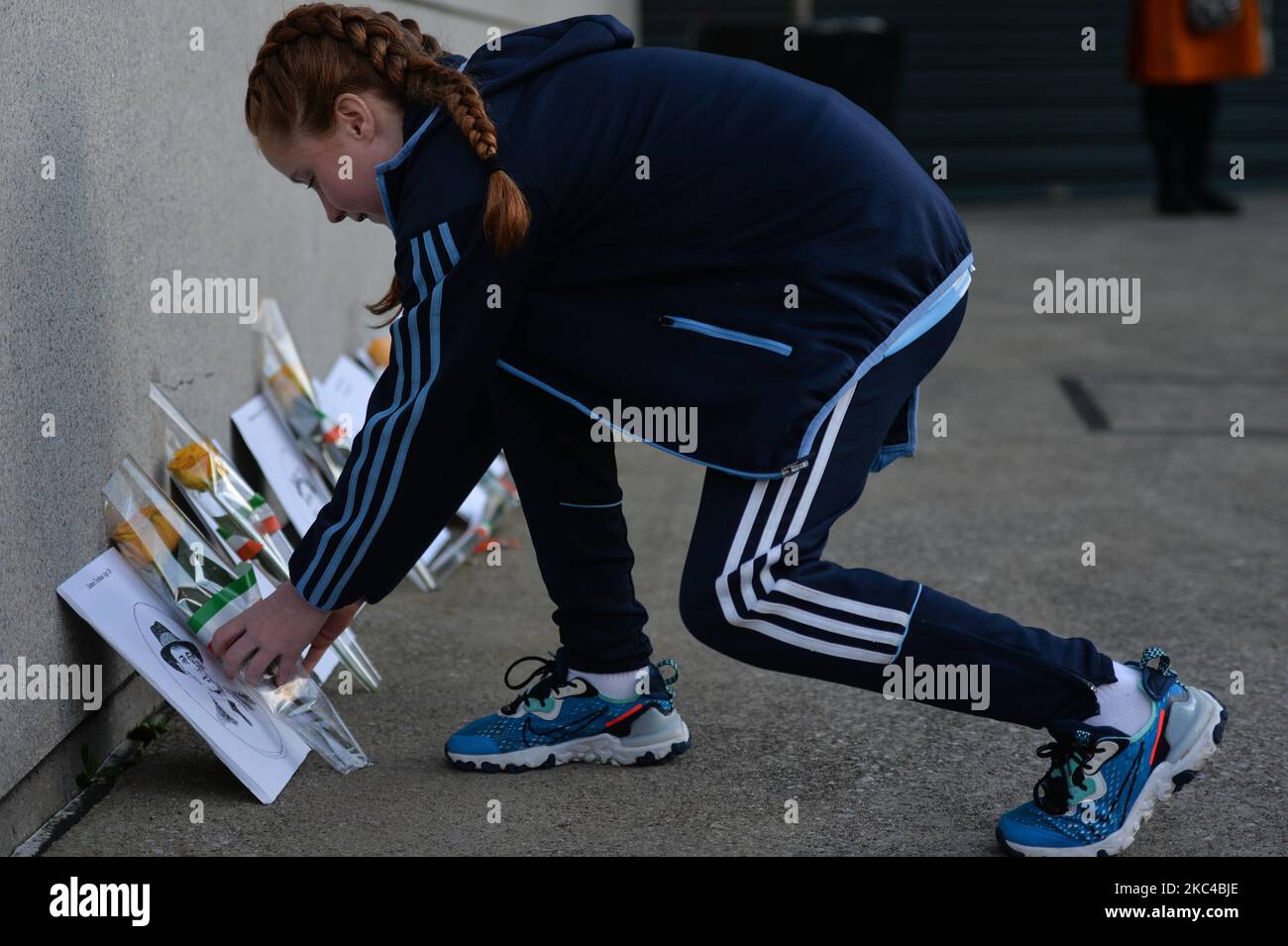 Ella Byrne (age 10) from Ballymun, placing a flower and a picture of ...